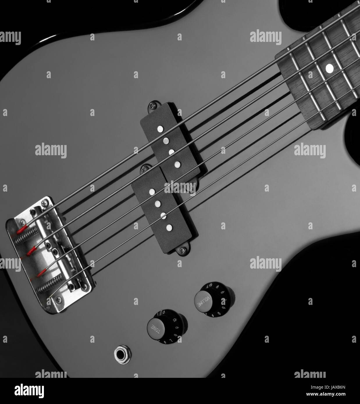 detail of a black bass guitar in dark back Stock Photo - Alamy