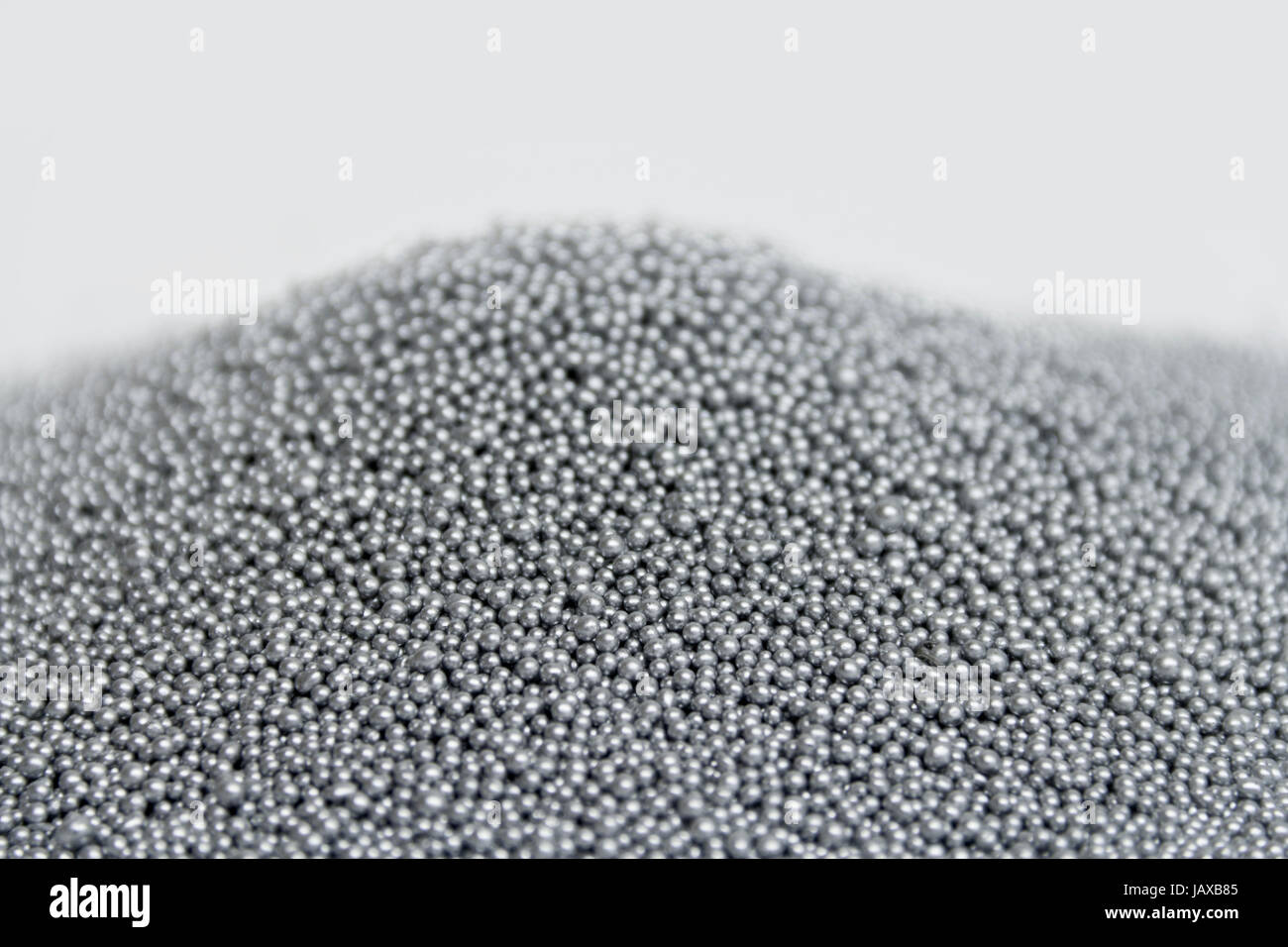 pile of silver metallic beadlets in light back Stock Photo - Alamy