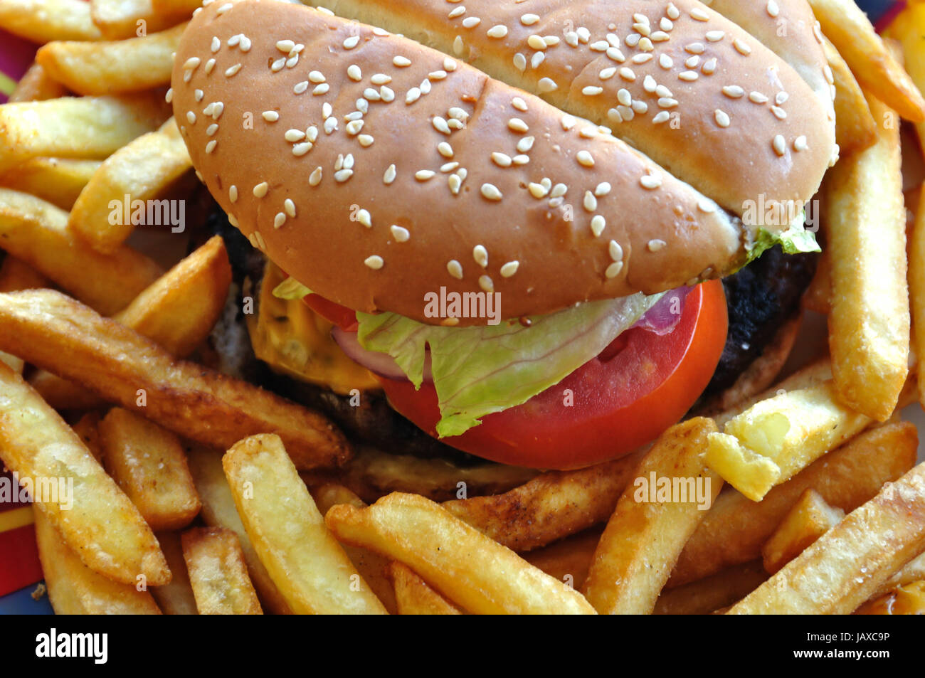 Cheeseburger and chips detail. Fast food background Stock Photo - Alamy