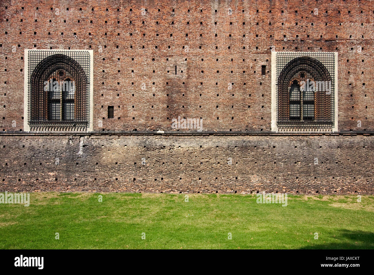 old brown castle brick and window in the grass of castle sforzesco ...