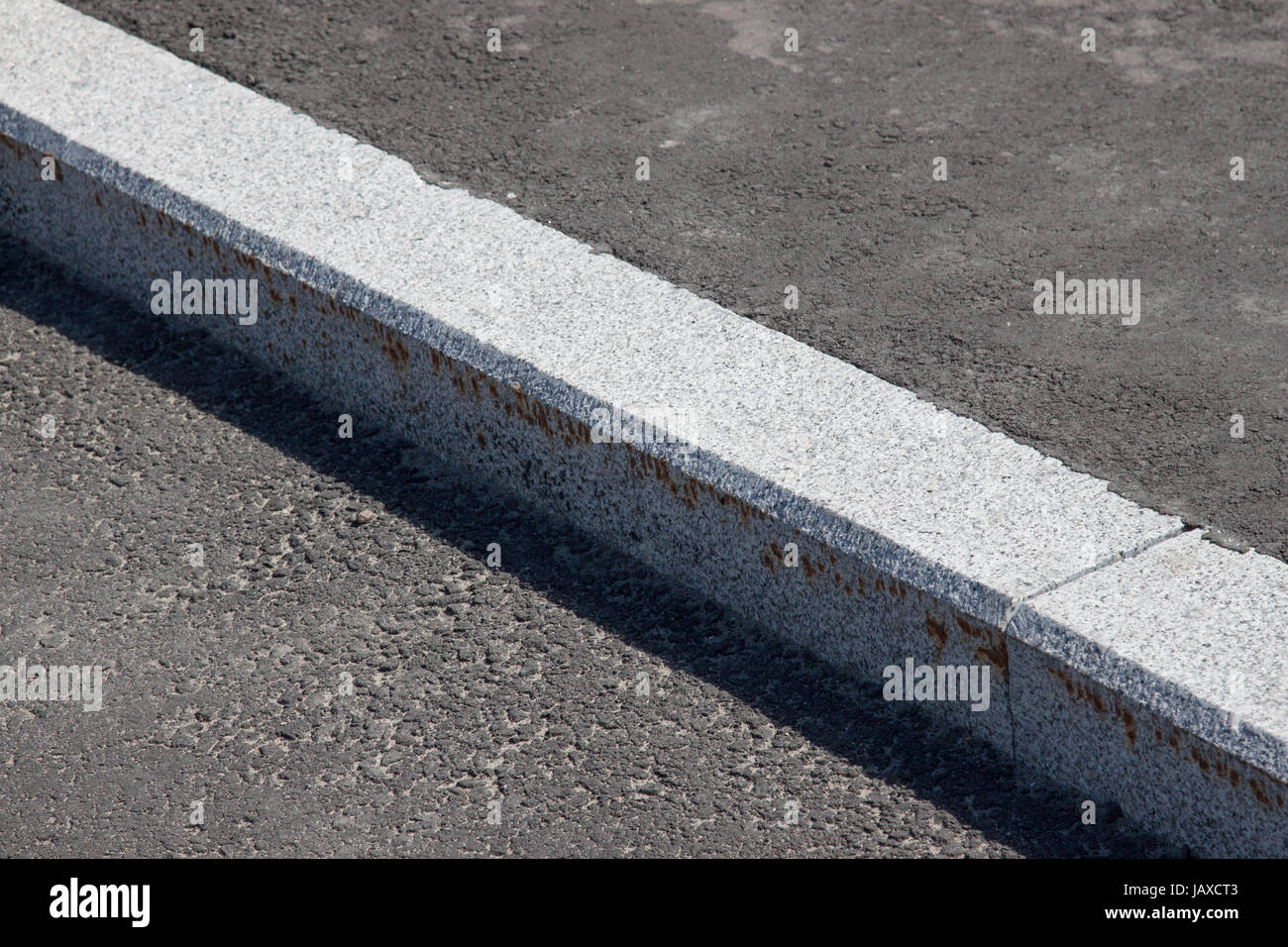 white curb stone border and asphalt road Stock Photo - Alamy
