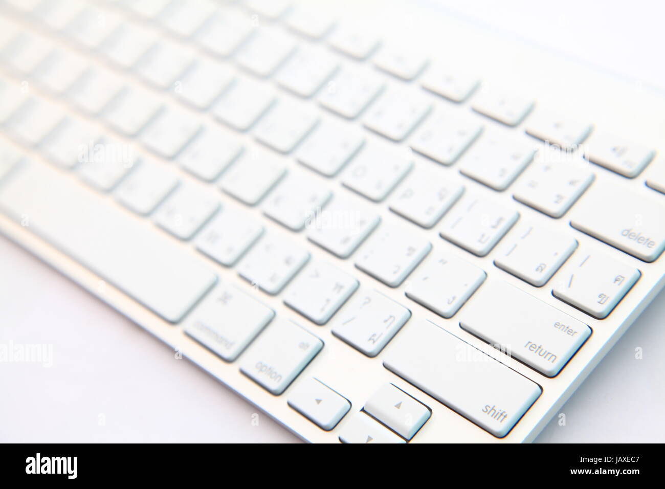 perspective of return button on white modern keyboard Stock Photo - Alamy