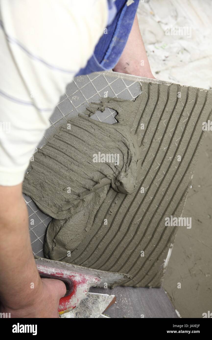 Tiler work bonding floor tile hi-res stock photography and images - Alamy
