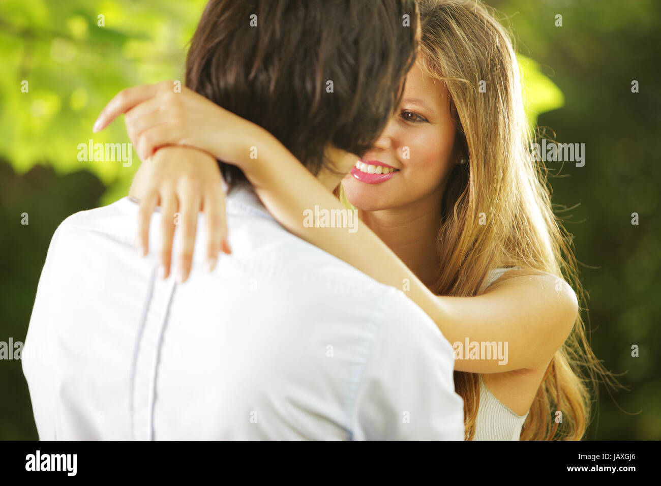 a young couple in love having a romantic moment in the park Stock Photo ...