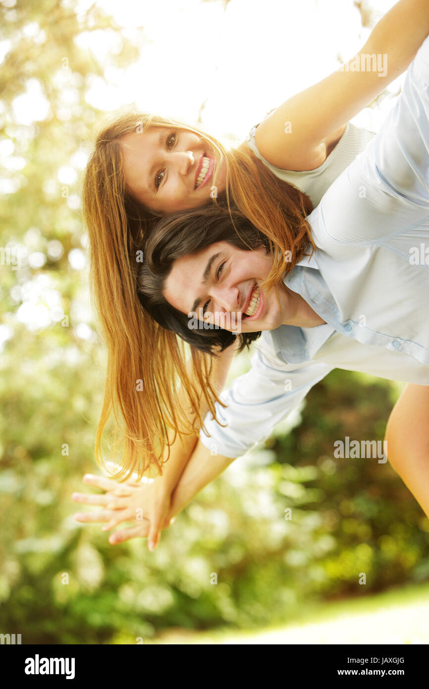 a young couple in love having fun in the park Stock Photo - Alamy