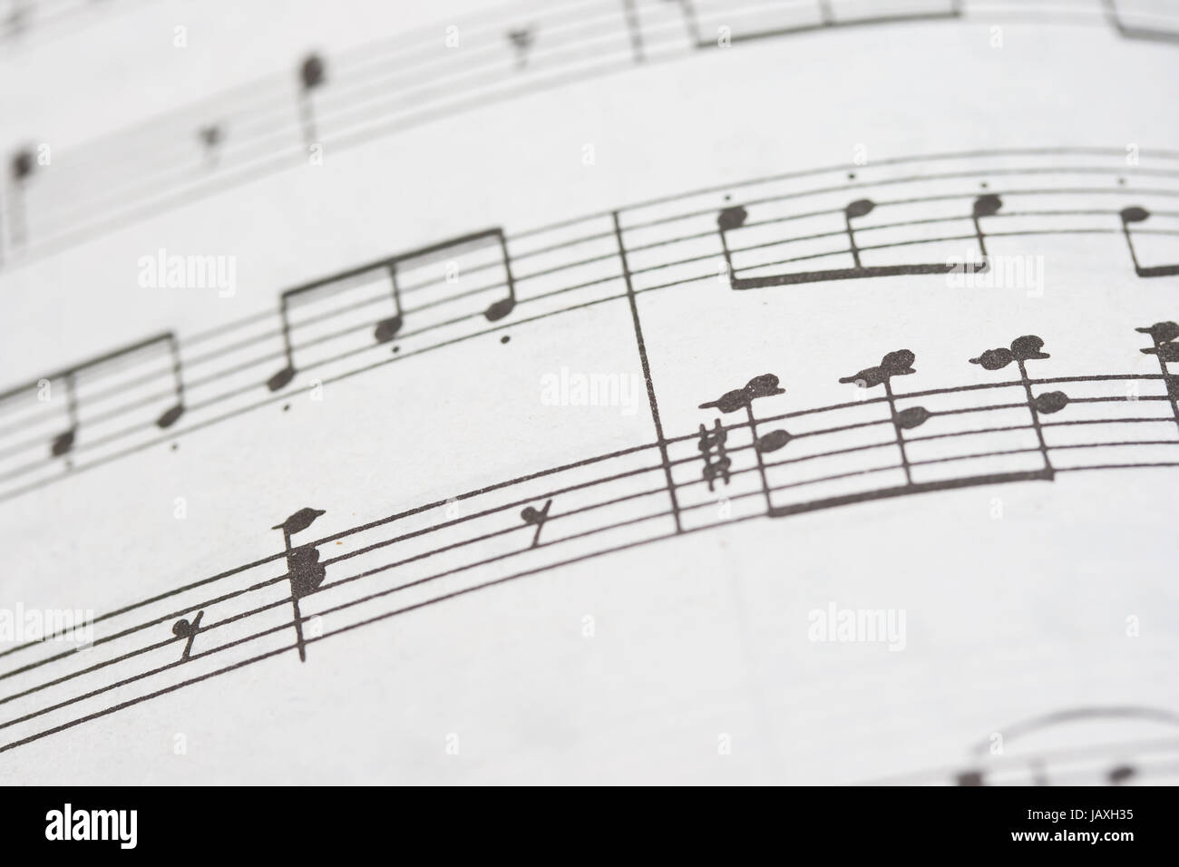 Sheet of paper with black musical notes Stock Photo - Alamy