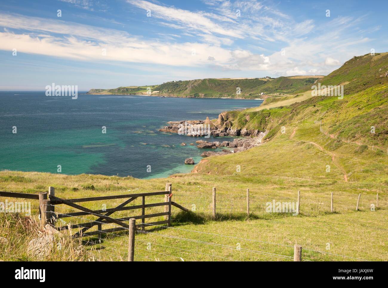 Farm gate overlookng Great Mattiscombe Sand, Devon, England Stock Photo ...
