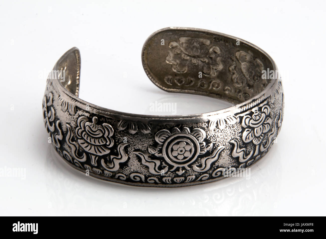 Tibet silver bracelet engraved with delicate patterns Stock Photo - Alamy