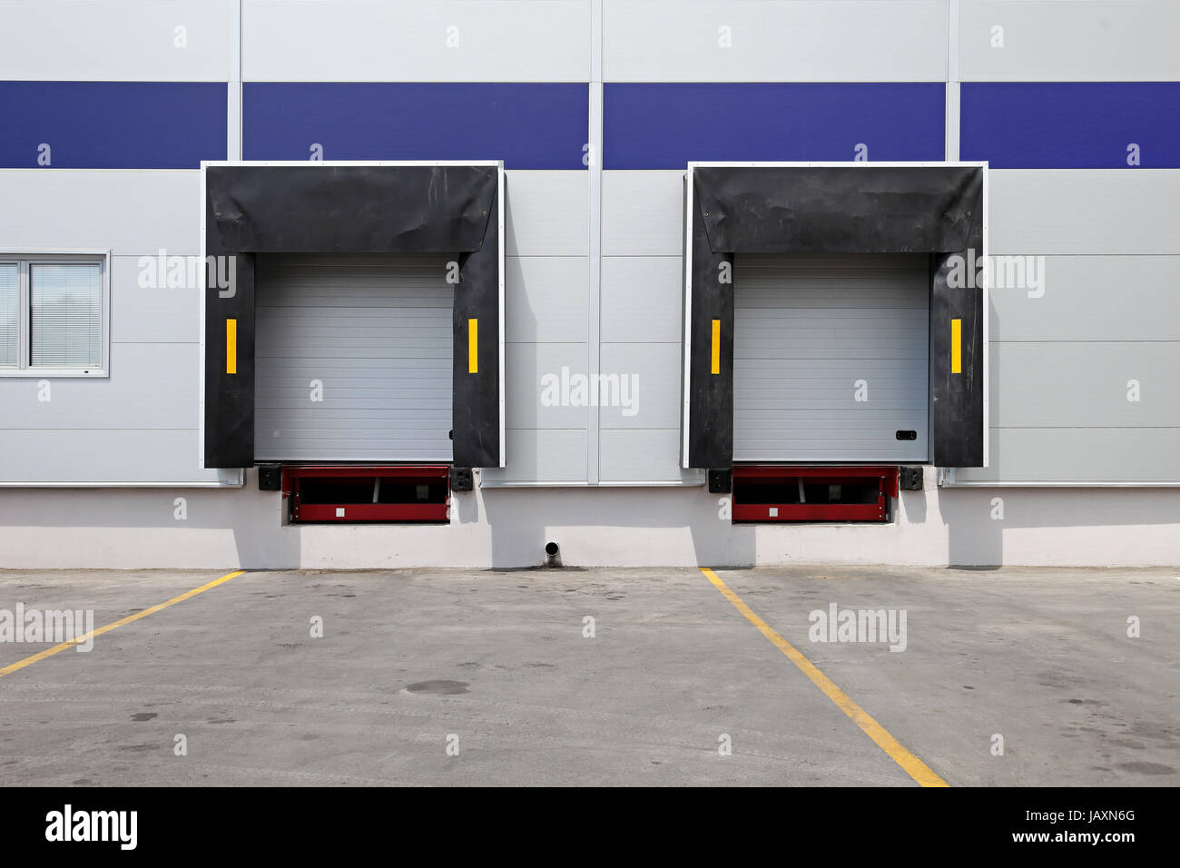 Two dock doors at warehouse for loading lorry Stock Photo - Alamy