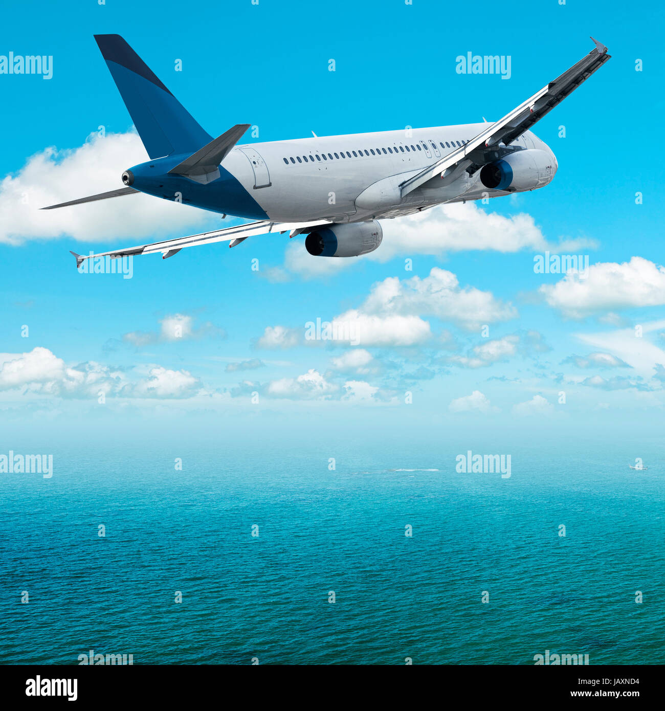 Jet over the tropical sea Stock Photo - Alamy