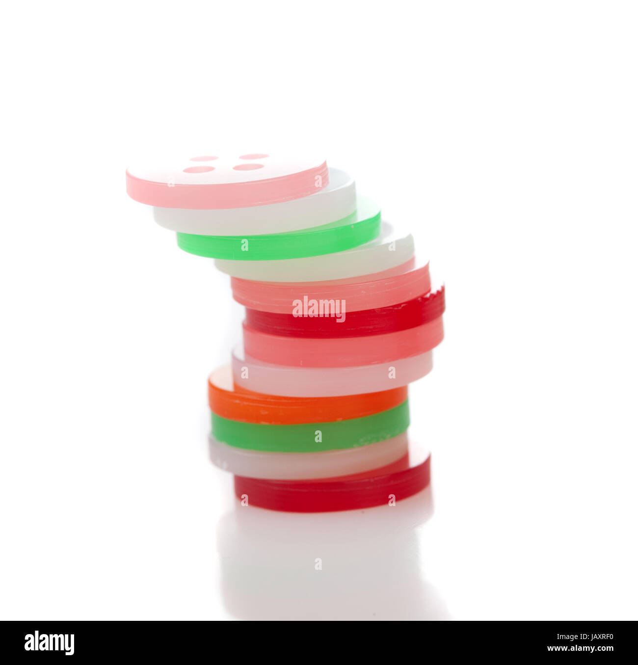 Close-up of a pile of plastic round tokens, symbol of currencies ...