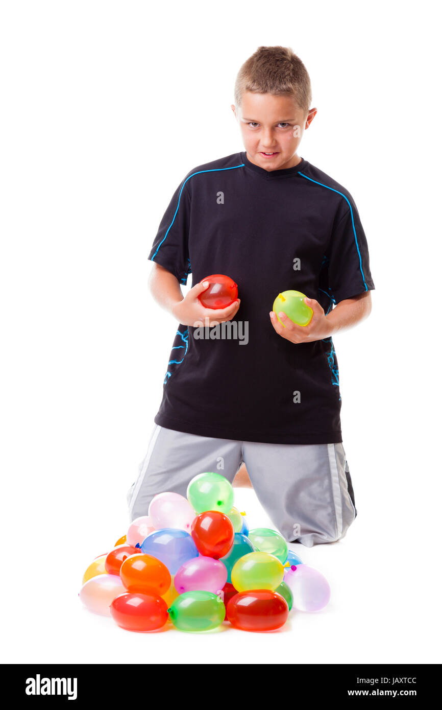 Boy with a pile of water balloons isolated on white background Stock ...