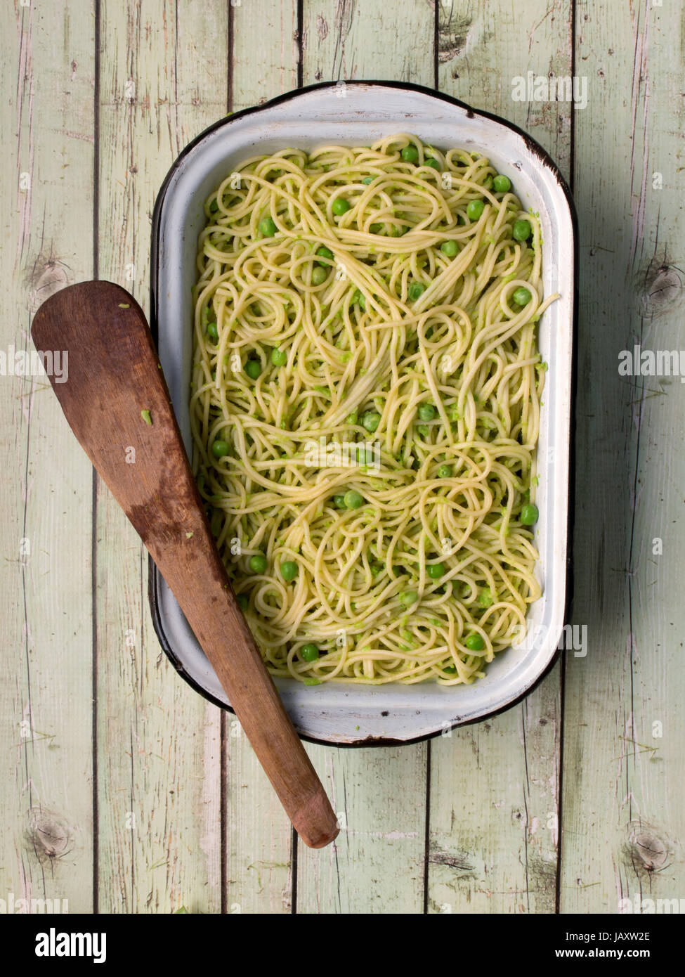 close up of a tray of rustic green pea spaghetti Stock Photo - Alamy