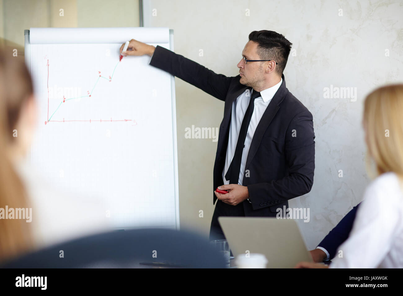 Businessman drawing graph hi-res stock photography and images - Alamy