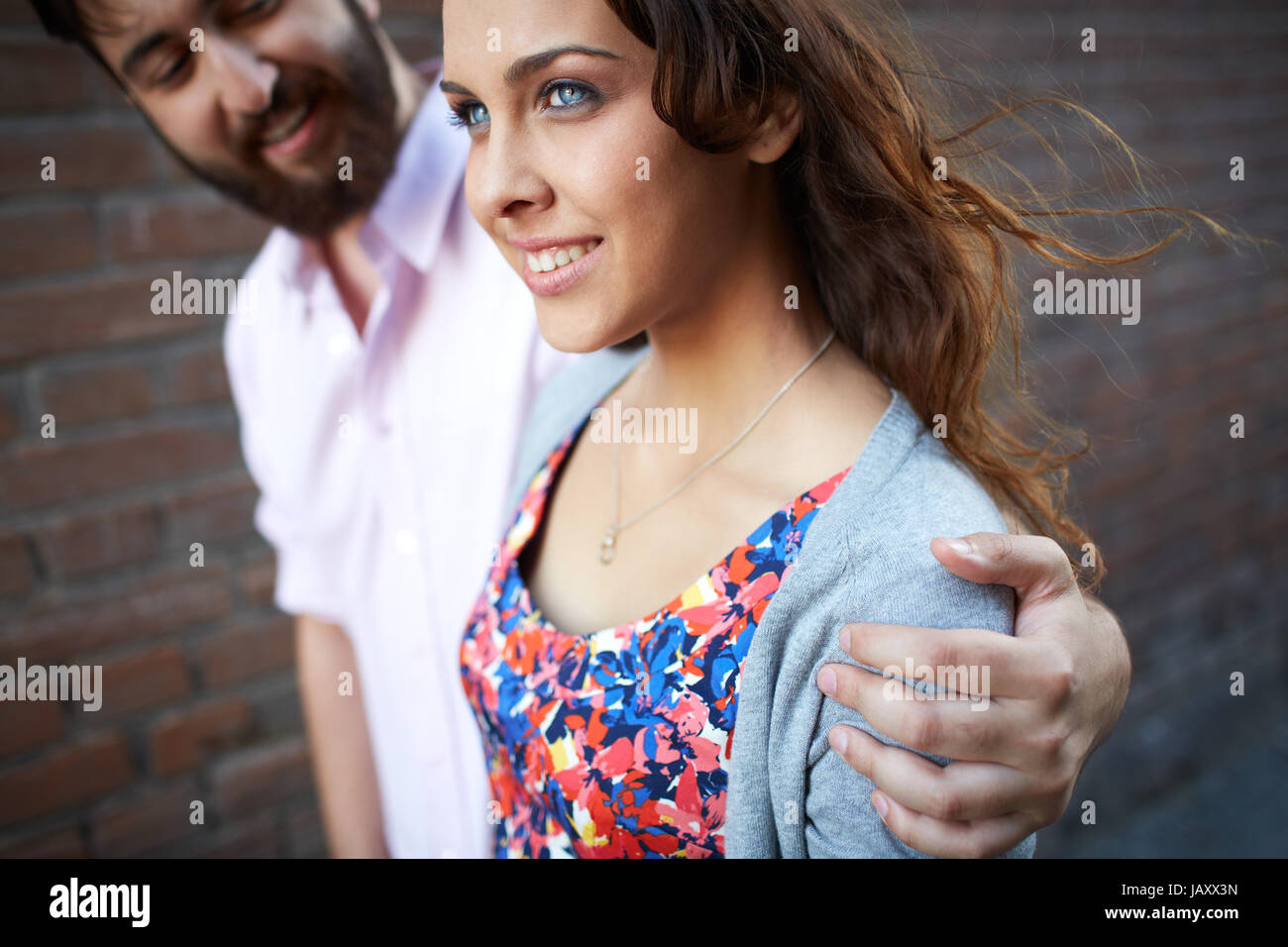 Handsome man embracing young girl while walking outdoors Stock Photo ...