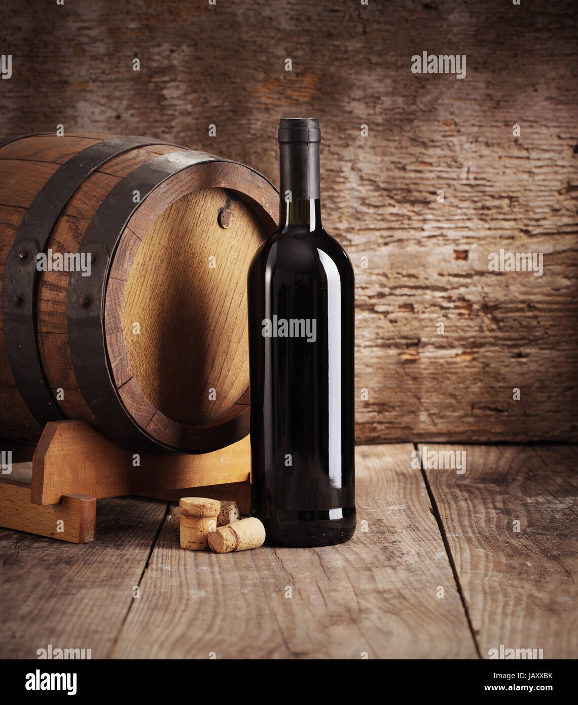 Red wine bottle with barrel and corks Stock Photo - Alamy