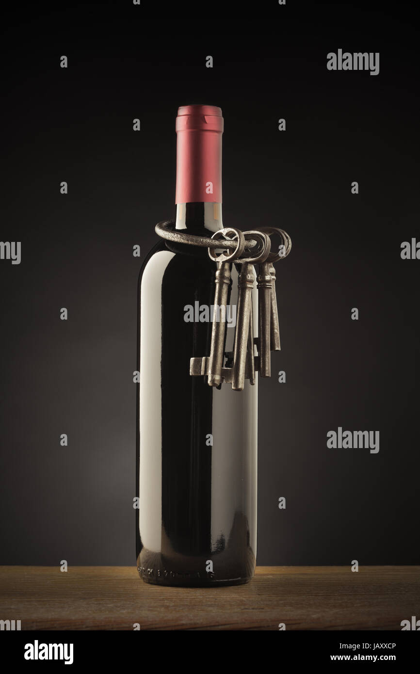 wine bottle with old iron keys Stock Photo - Alamy