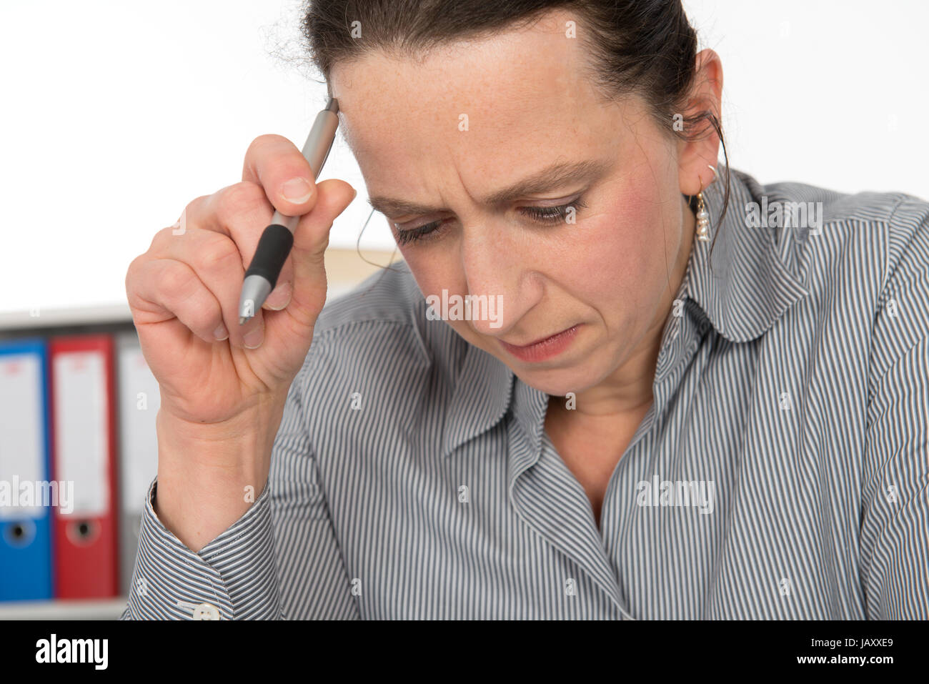 woman at work thinking Stock Photo - Alamy