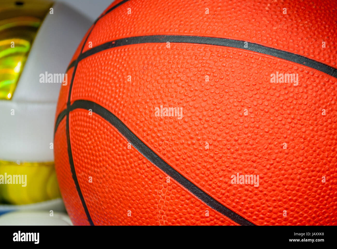 rough surface of a basketball with the typical orange and black colors ...