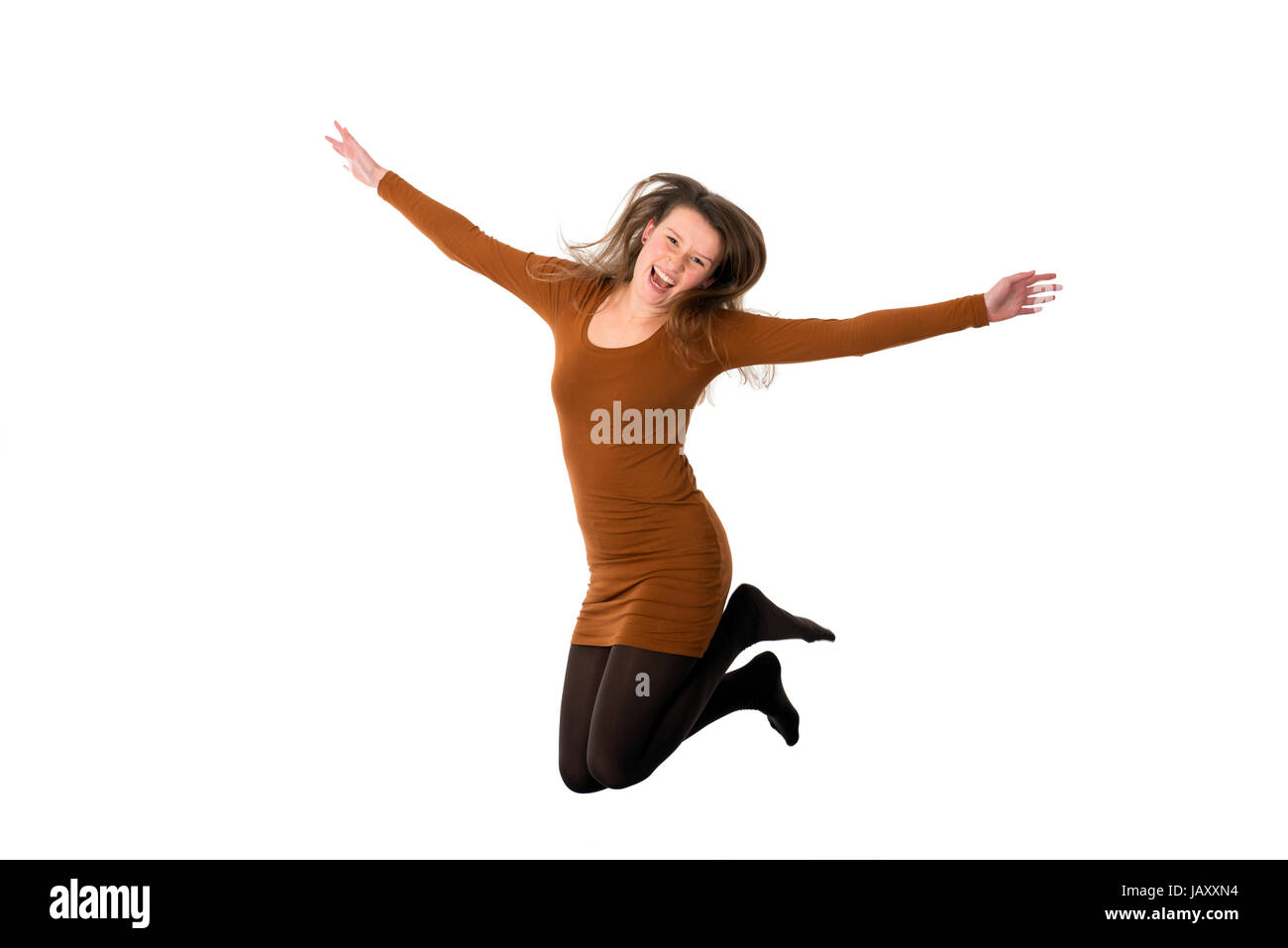young woman jumping for joy Stock Photo - Alamy