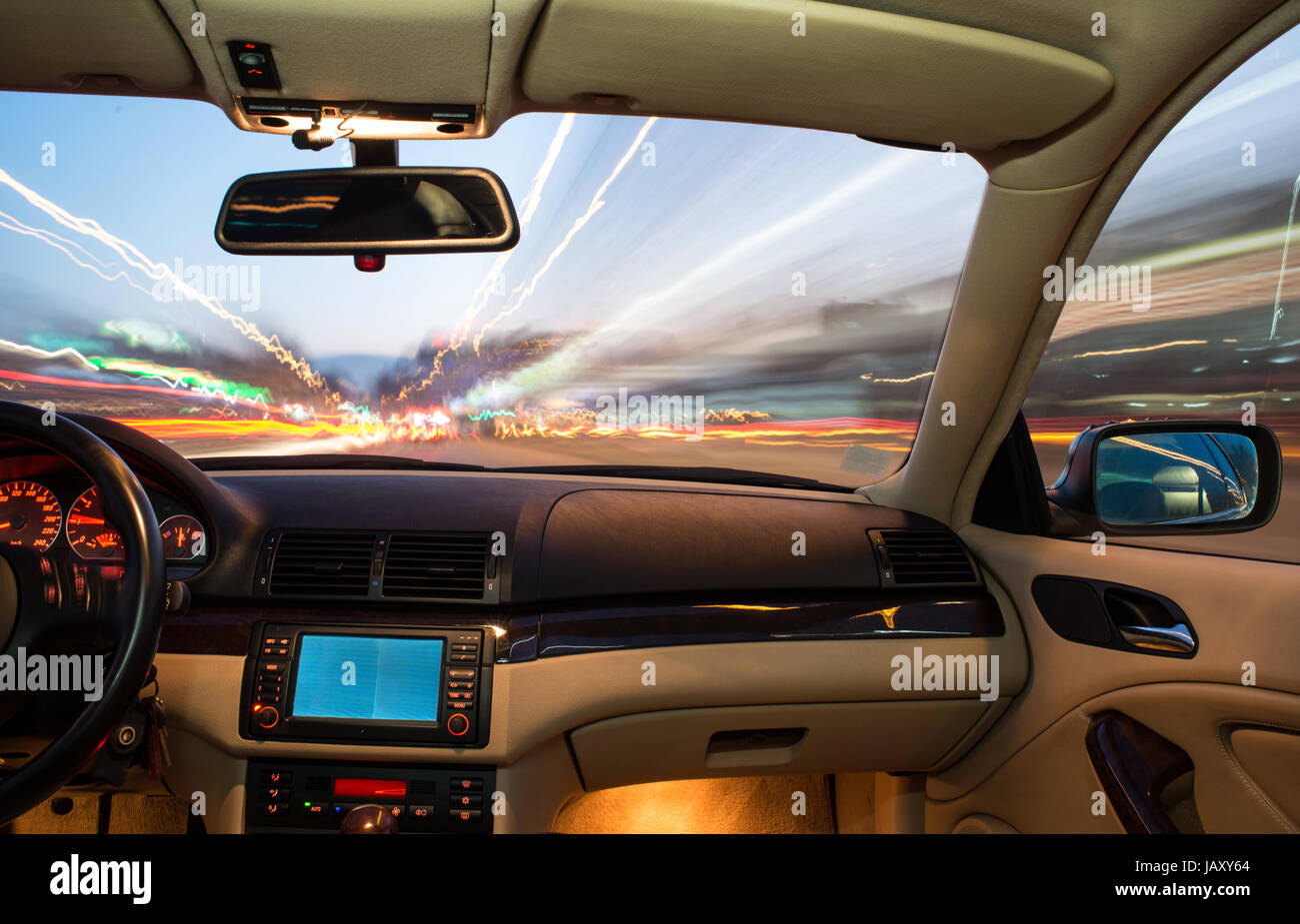 Car interior on driving. Blurred night lights Stock Photo - Alamy
