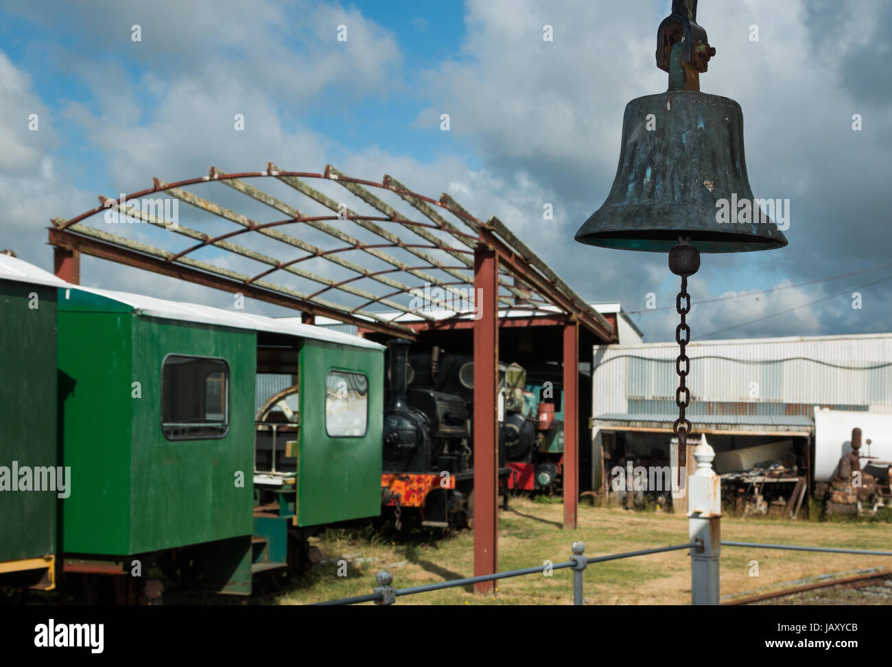 One old brass bell at a railway station Stock Photo - Alamy