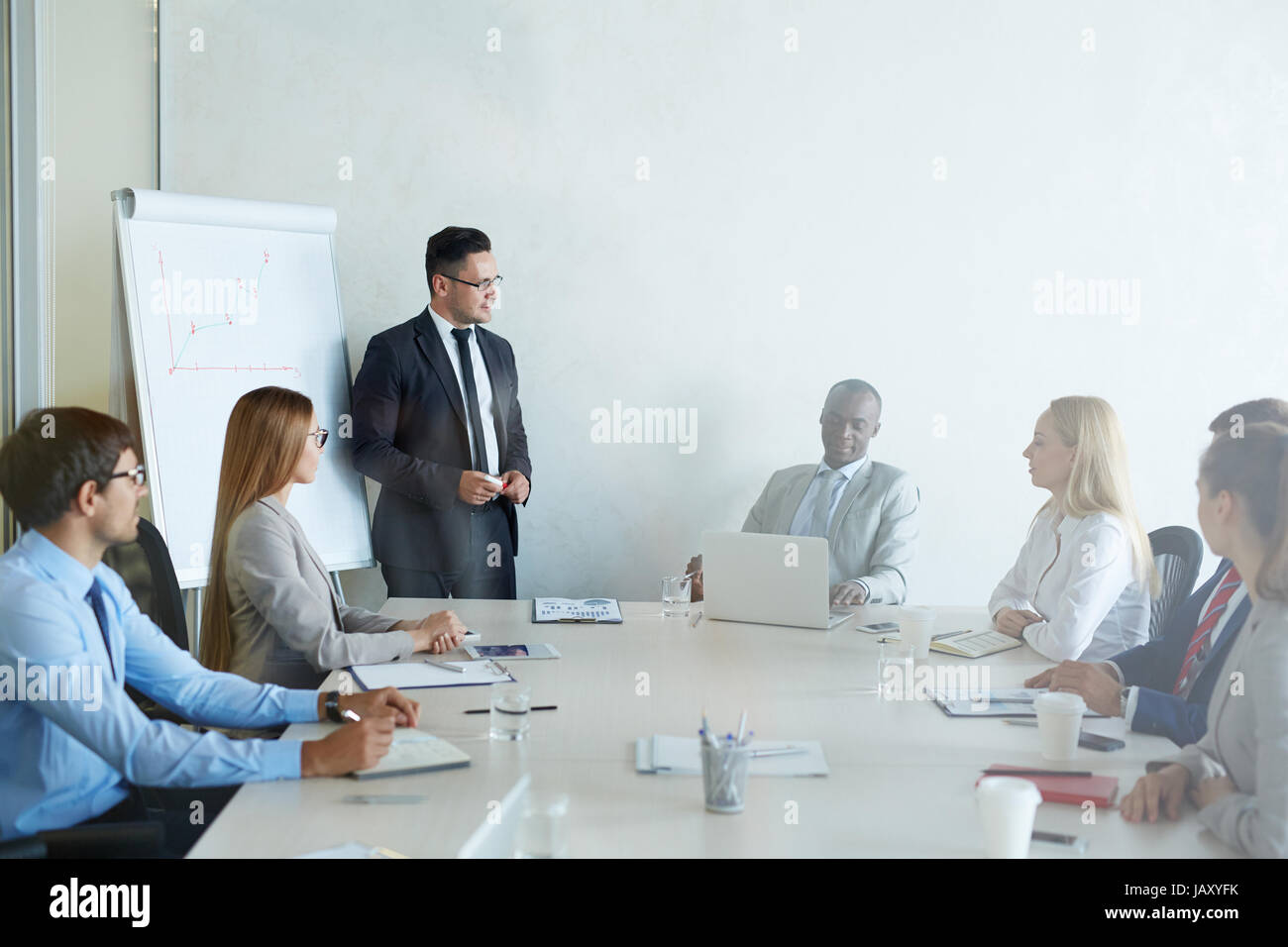 Having Training Session in Board Room Stock Photo - Alamy