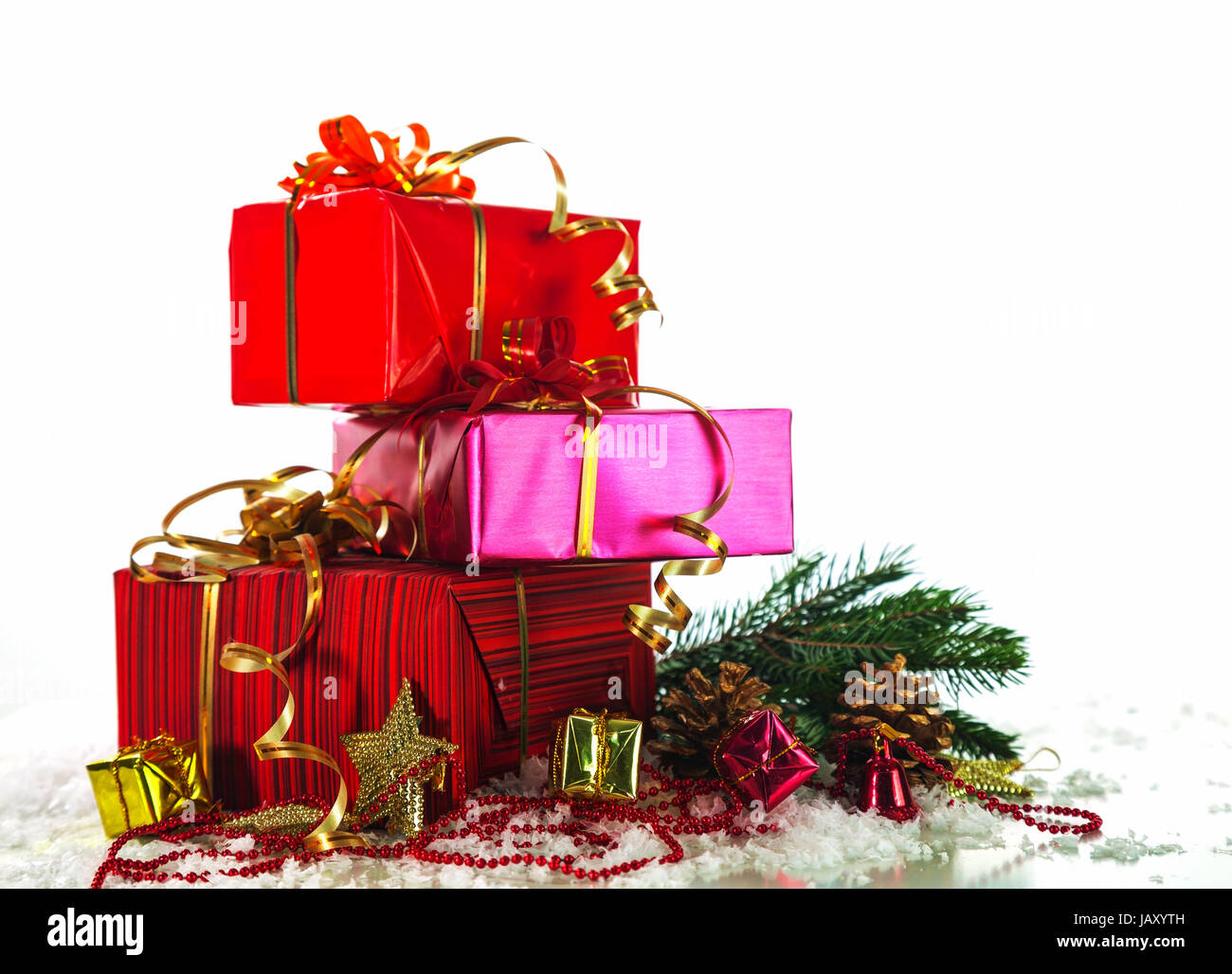 Christmas presents with evergreen branches Stock Photo - Alamy