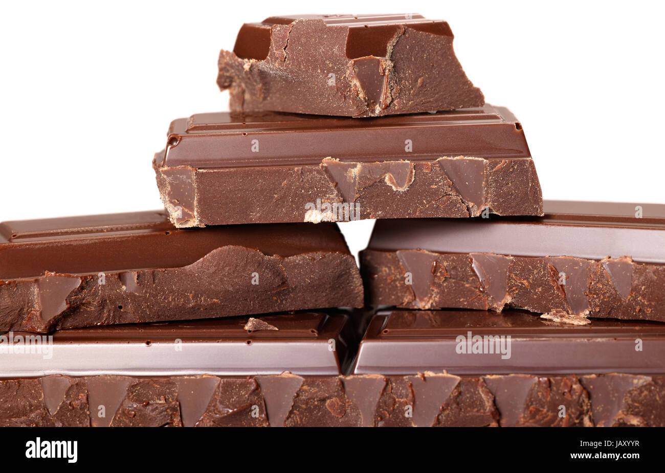 stacked chocolate pieces in light back Stock Photo - Alamy