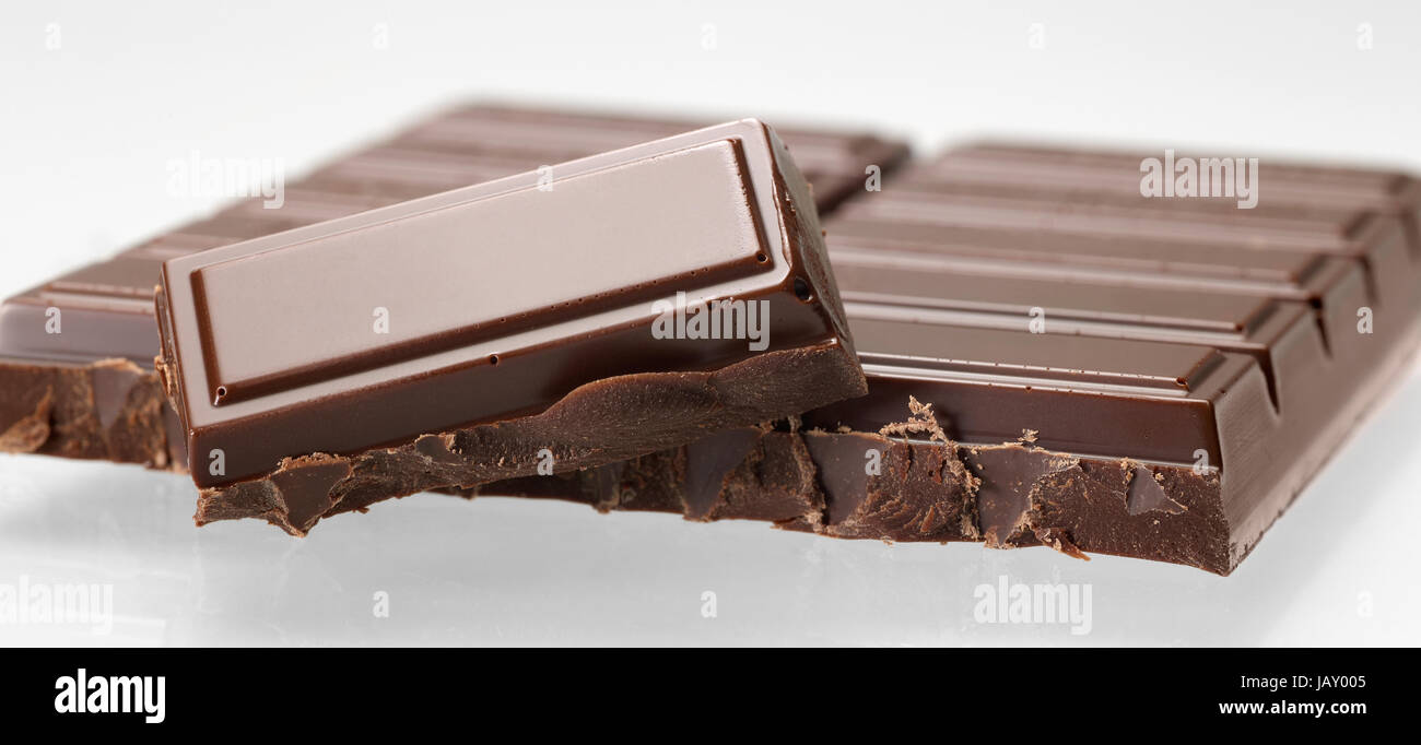 low angle shot of a chocolate bar in light reflective back Stock Photo ...