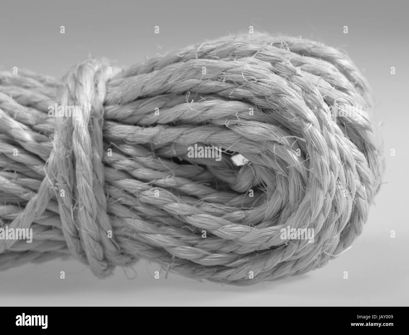 detail of a solid twine in light back, grey toned Stock Photo - Alamy