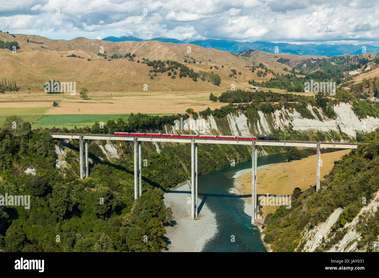 Stream train cross over one of New Zealand tallest trestle bridge over ...