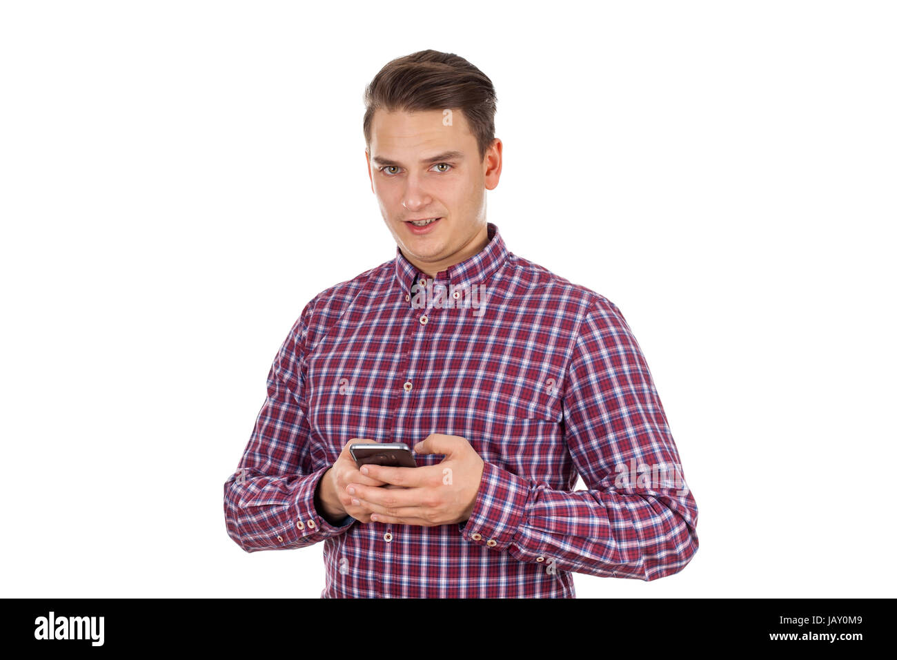 Picture of a handsome young man holding his smartphone Stock Photo - Alamy