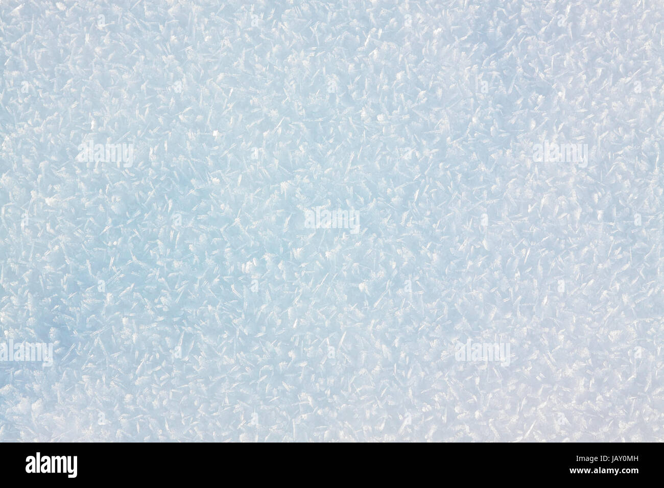 White snow crystals background texture Stock Photo - Alamy