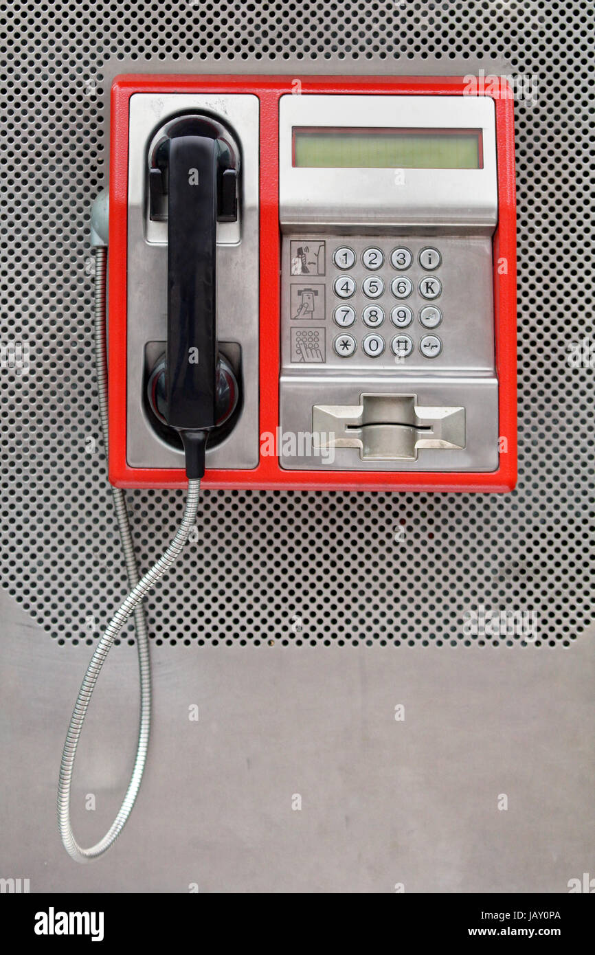 Red public retro design payphone outside on street Stock Photo - Alamy