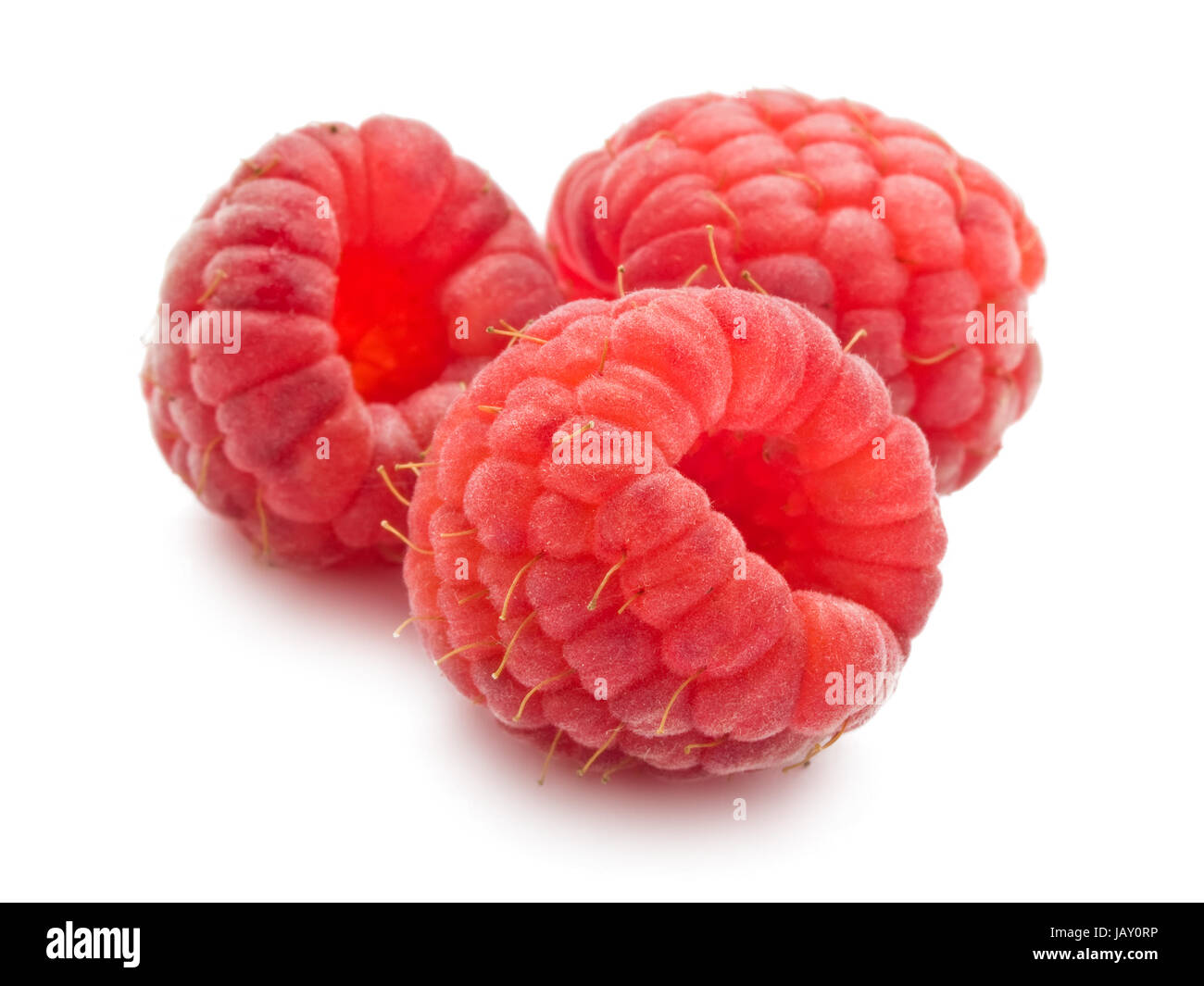 Ripe red raspberries isolated on white background Stock Photo - Alamy