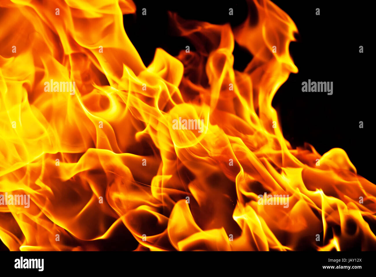 Beautiful yellow and orange hot fire on black background Stock Photo ...