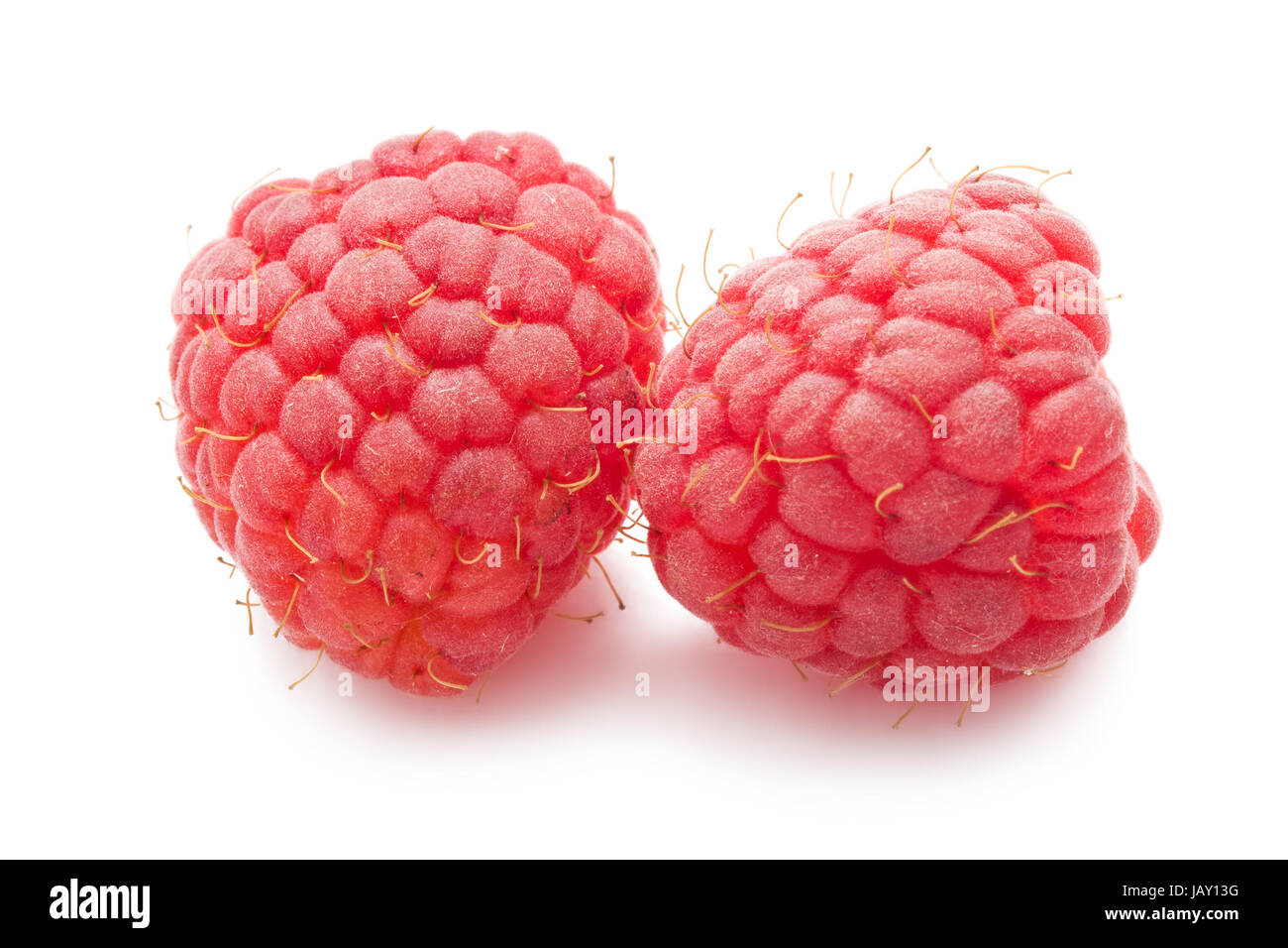 Ripe red raspberries isolated on white background Stock Photo - Alamy