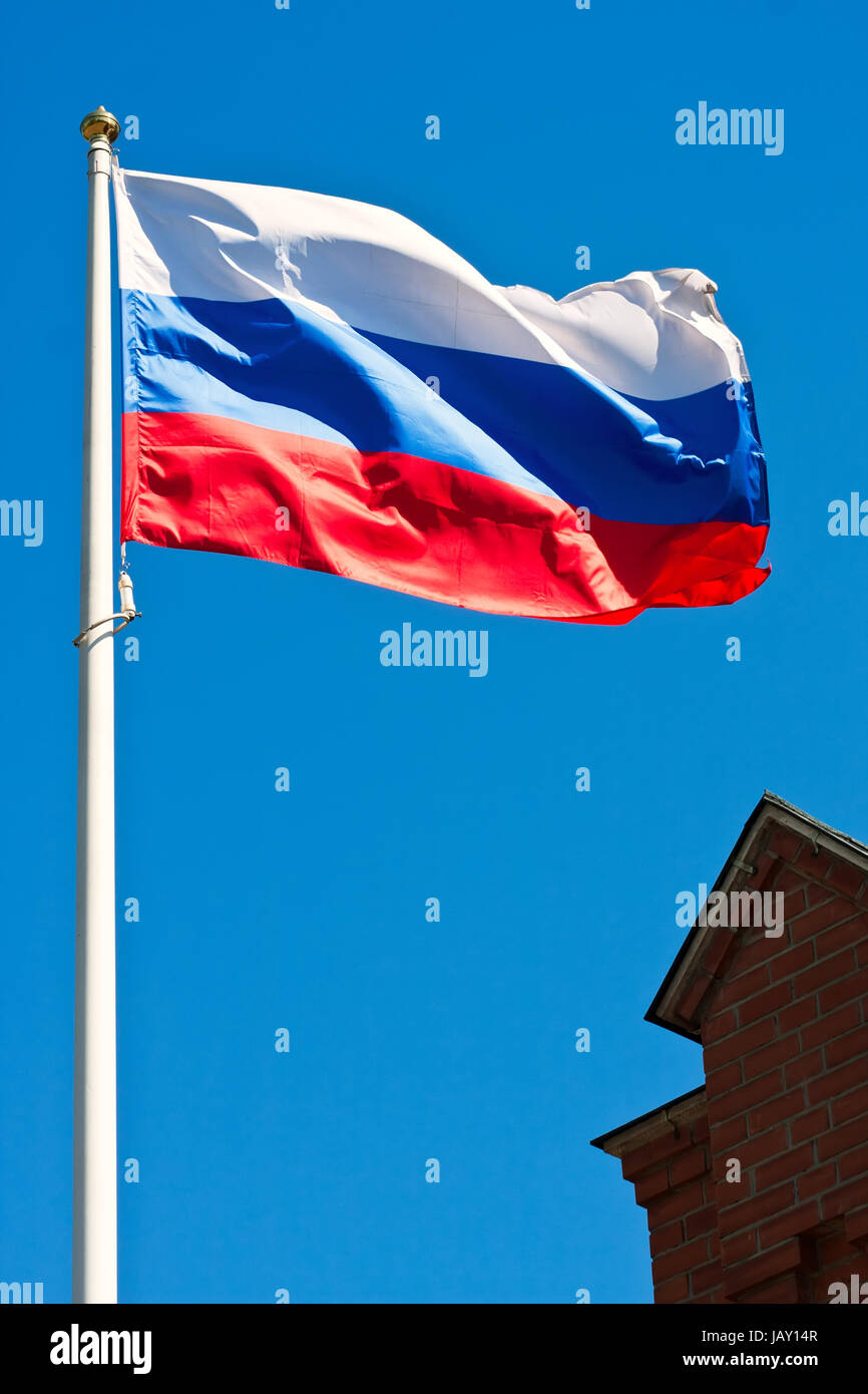 Russian flag on background of blue sky Stock Photo - Alamy