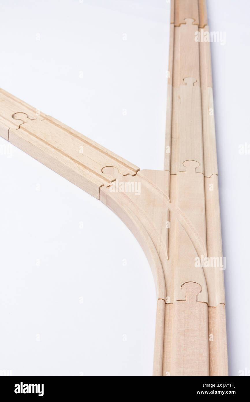 forked wooden railroad track on grey background. vertical image Stock ...