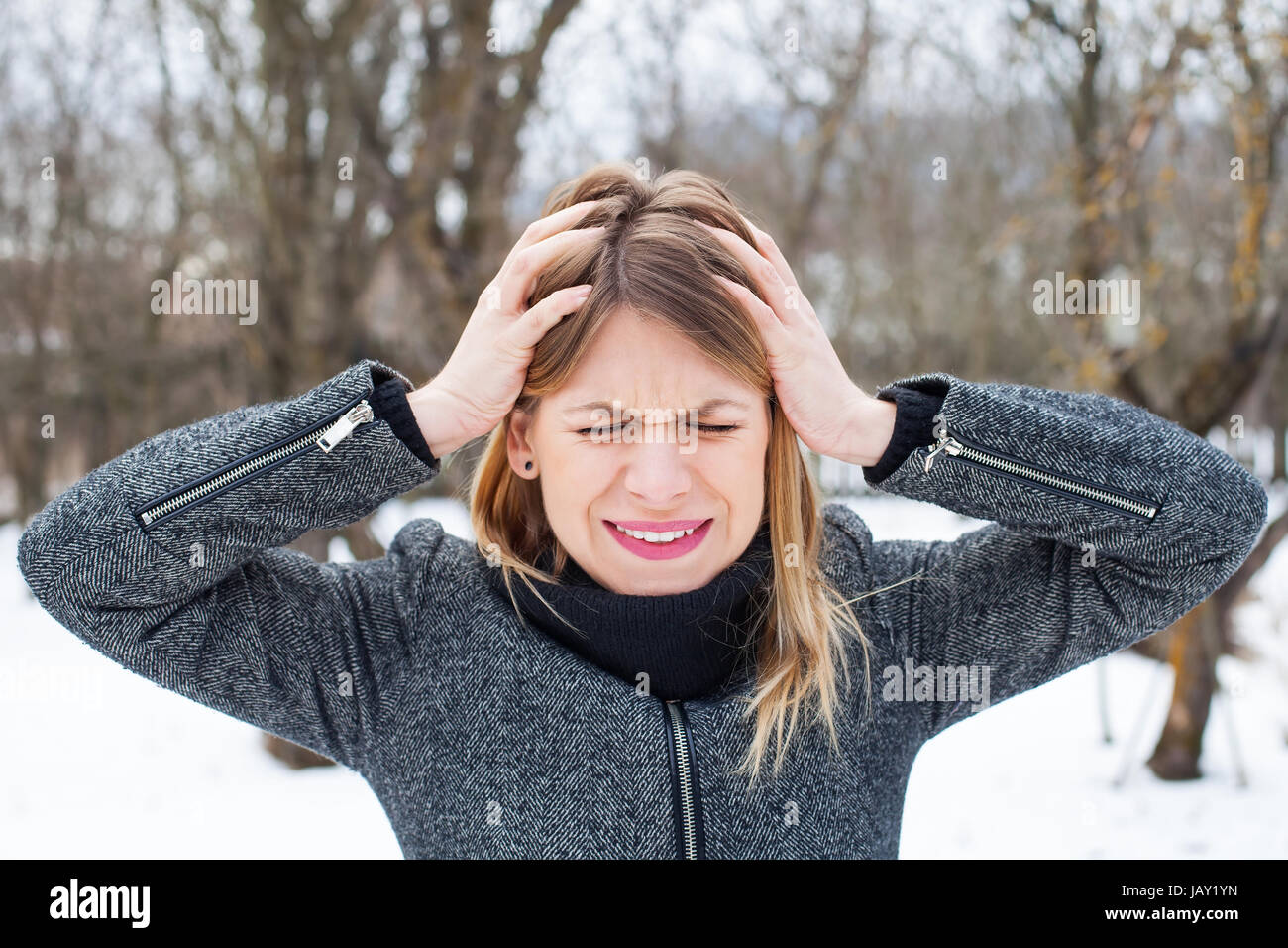 Picture of a young female having a bad headache outdoor Stock Photo - Alamy