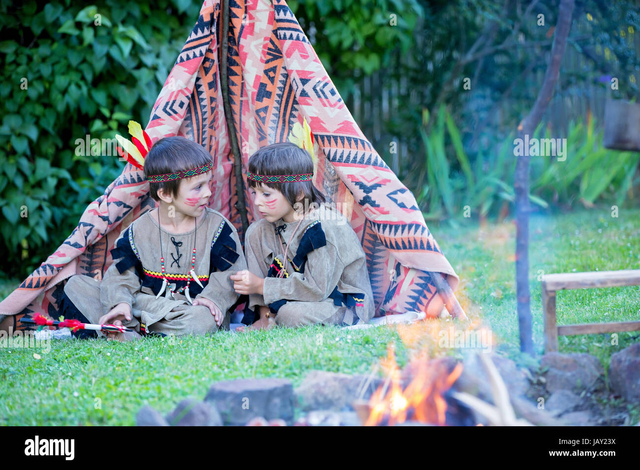 Cute portrait of native american boys with costumes, playing outdoor ...