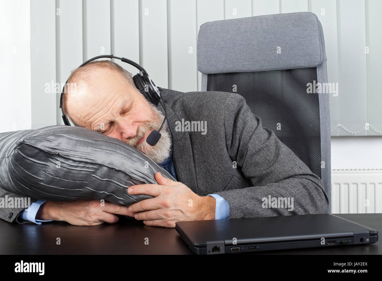 Picture of an overworked businessman sleeping at the office Stock Photo ...
