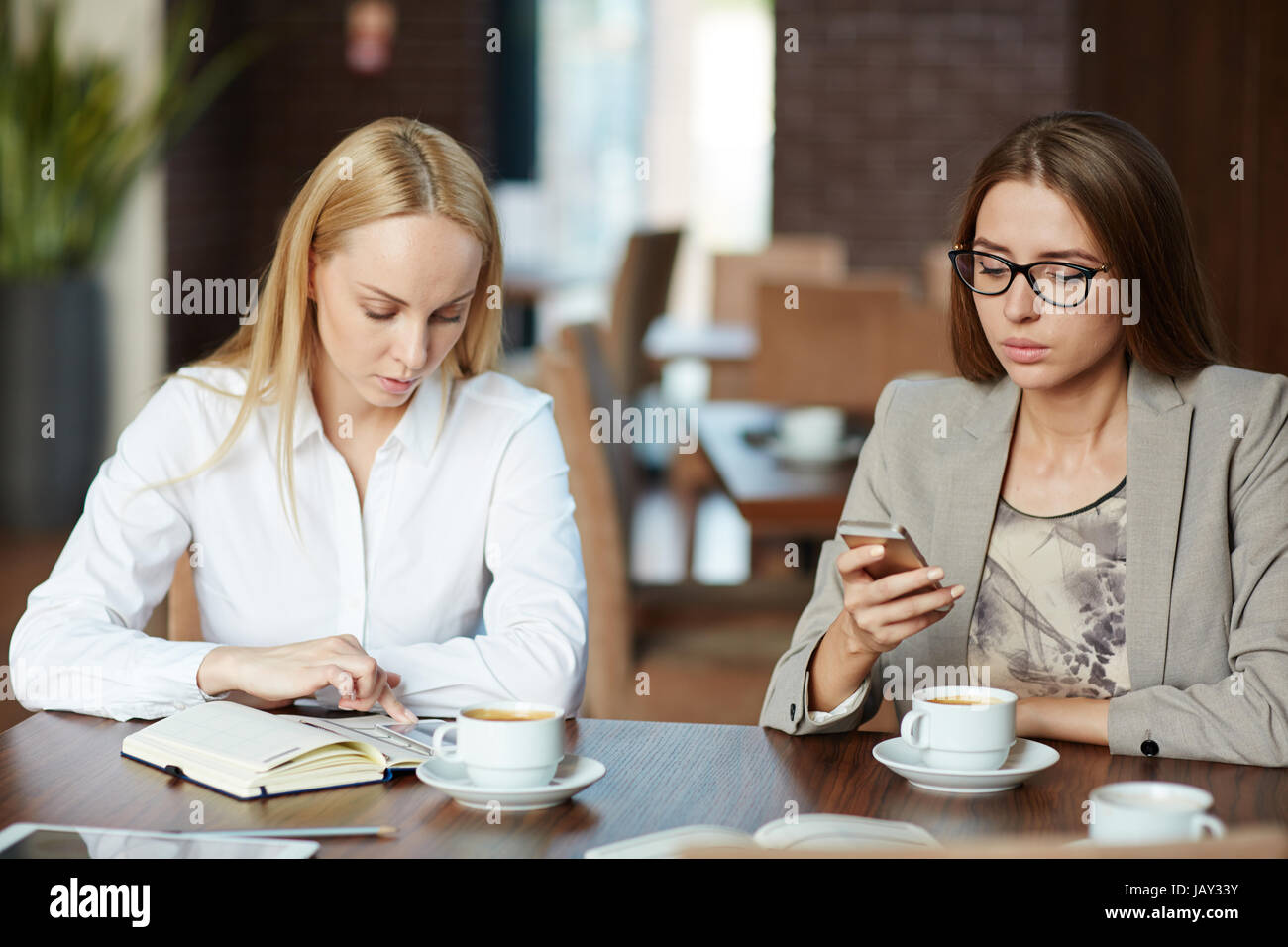 Young pretty businesswoman sitting hi-res stock photography and images ...