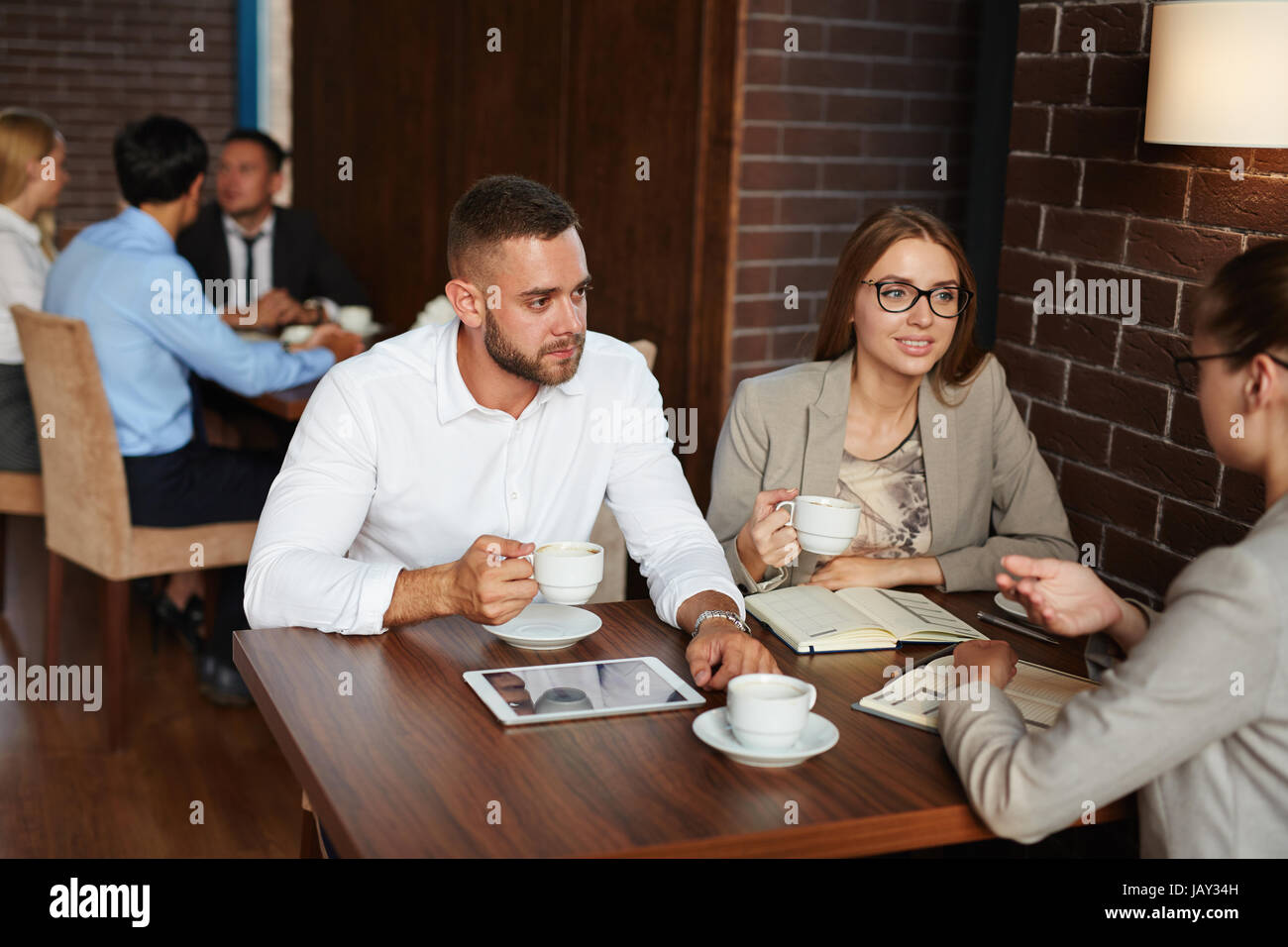 Chatting with Colleagues at Coffee Break Stock Photo - Alamy