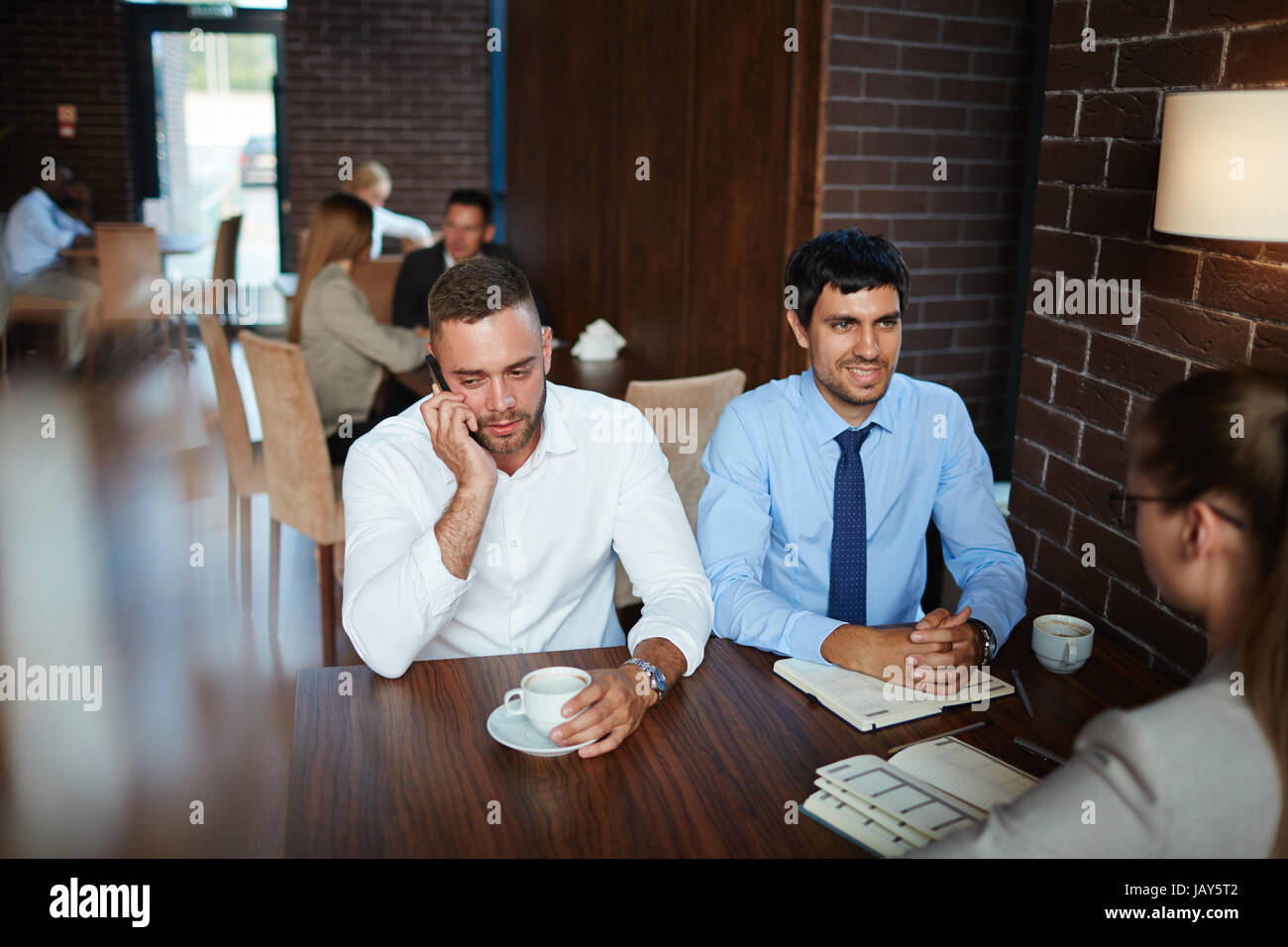 Project Discussion at Lunchtime Stock Photo - Alamy