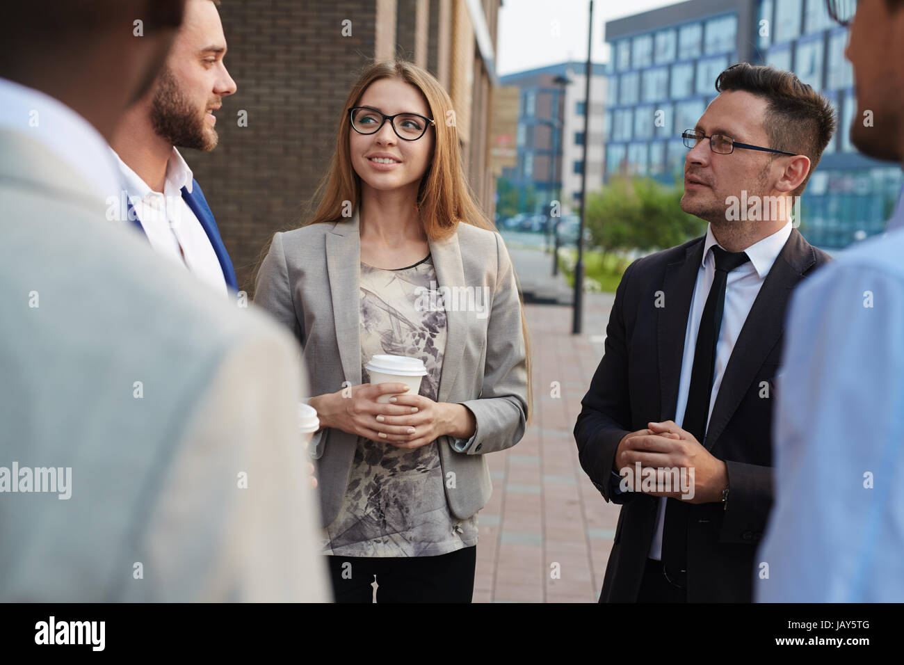 Chatting with Colleagues Outdoors Stock Photo - Alamy
