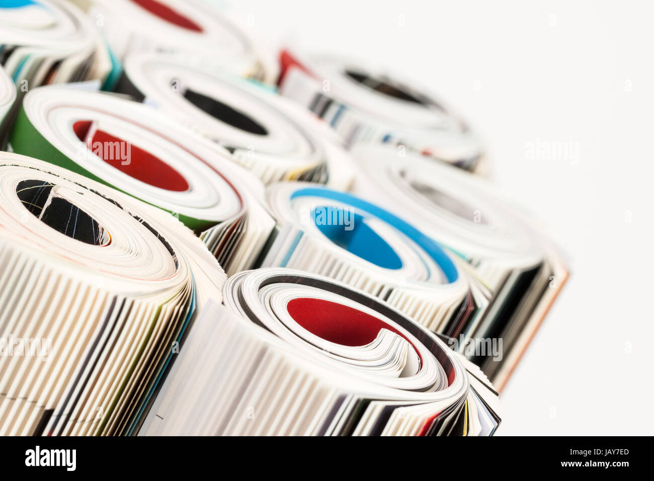 Stack of color magazines on white background Stock Photo - Alamy