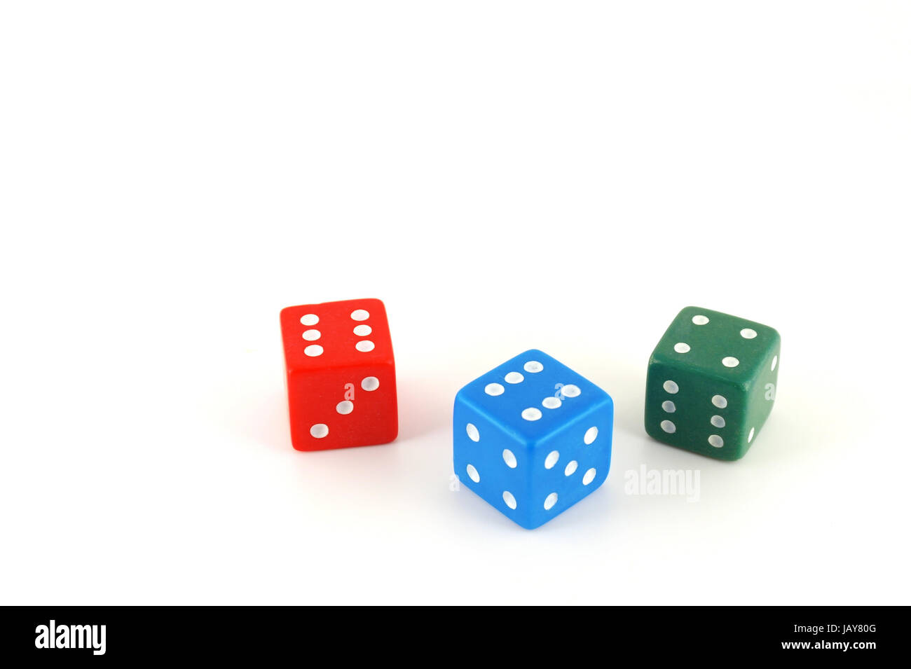 Three color dice over white Stock Photo - Alamy