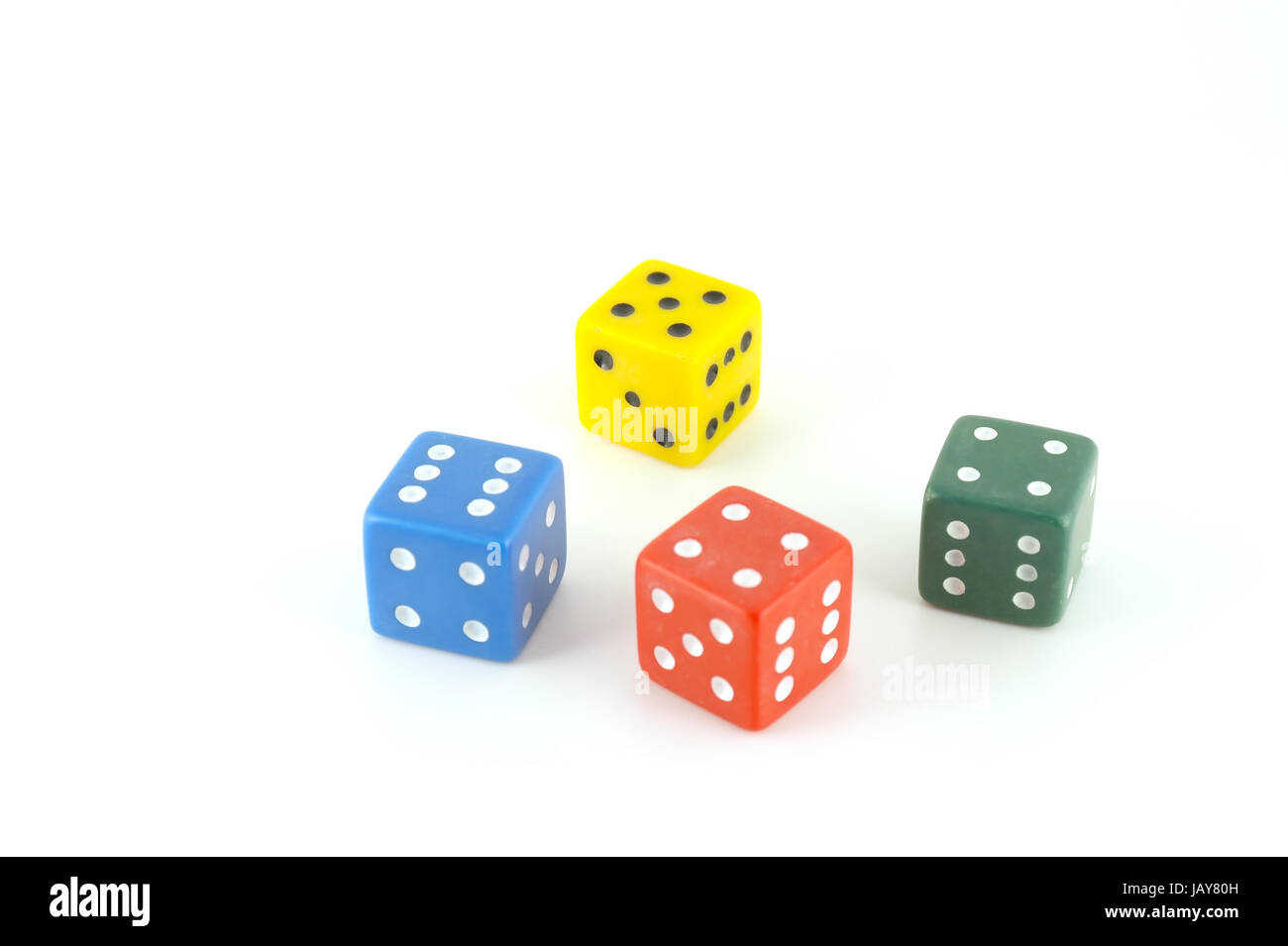 Four color dice over white Stock Photo - Alamy